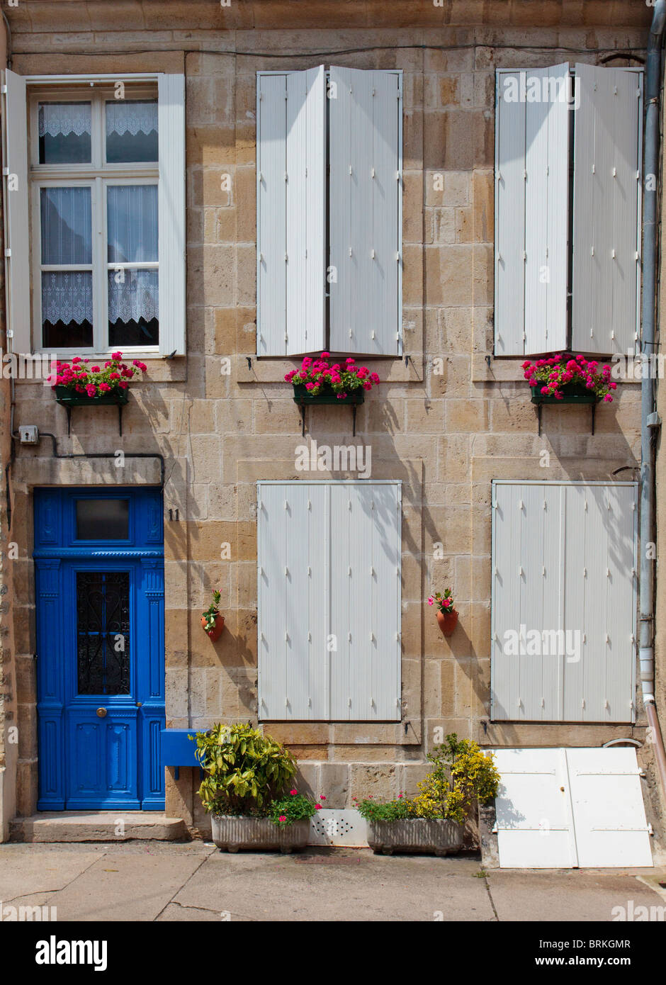 Caption Red tractor rotovating a field of straw stubble in France Stock ...