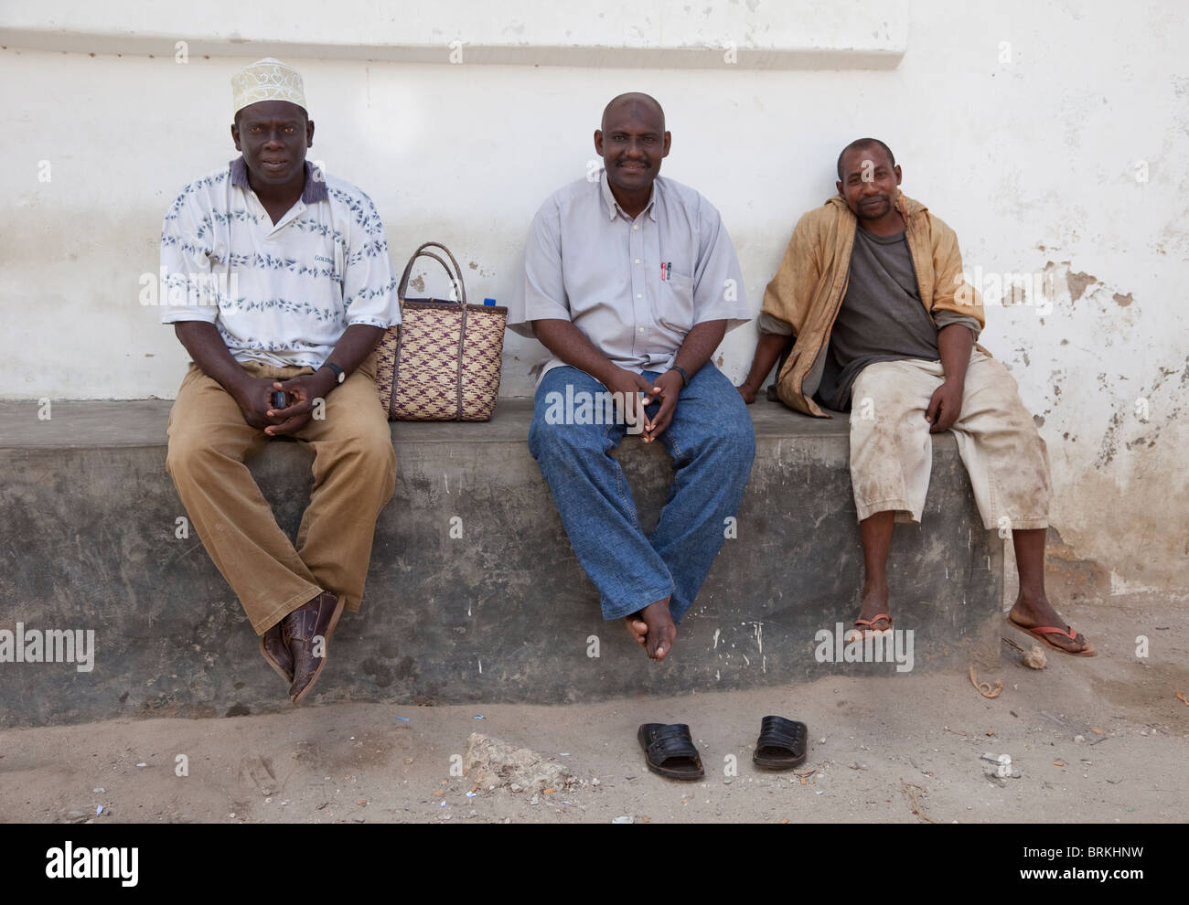 Stone Town, Zanzibar, Tanzania. Three Men Sitting on a Baraza, a Stone ...