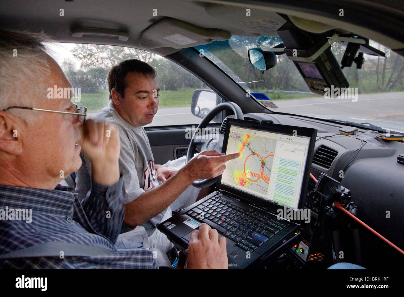 Vortex 2 storm chasers Tim Marshall (foreground, left) and Shawn ...