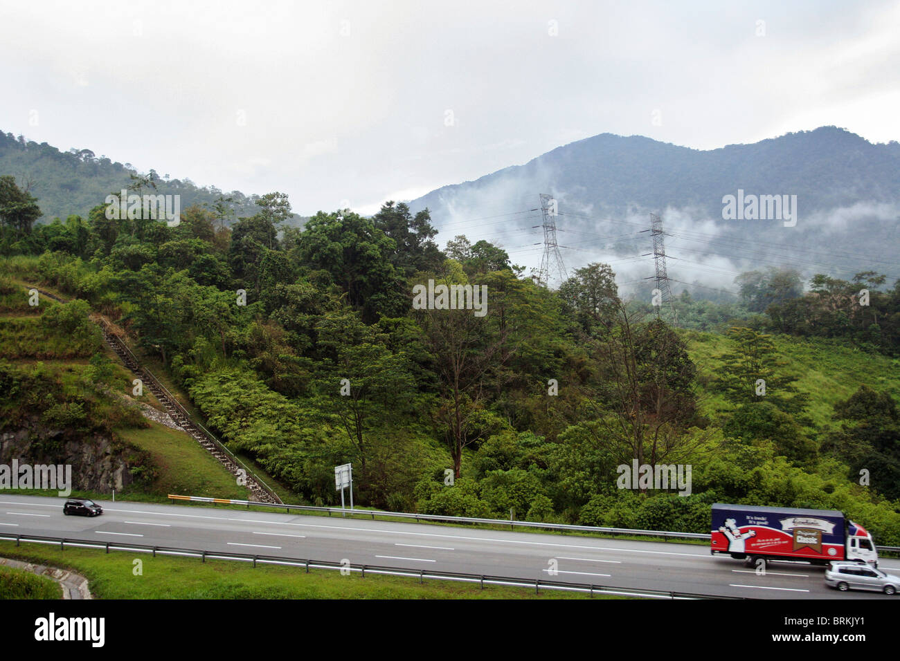 Karak Highway cutting through tropical rain forest in Malaysia Stock ...