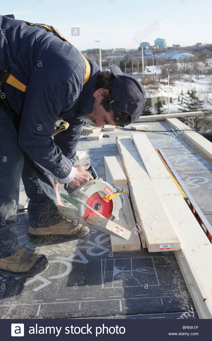 A carpenter hard at work during a winter afternoon in Ottawa Stock ...