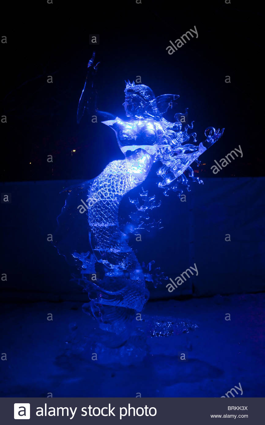 An ice sculpture created for the Winterlude festival is lit at night ...