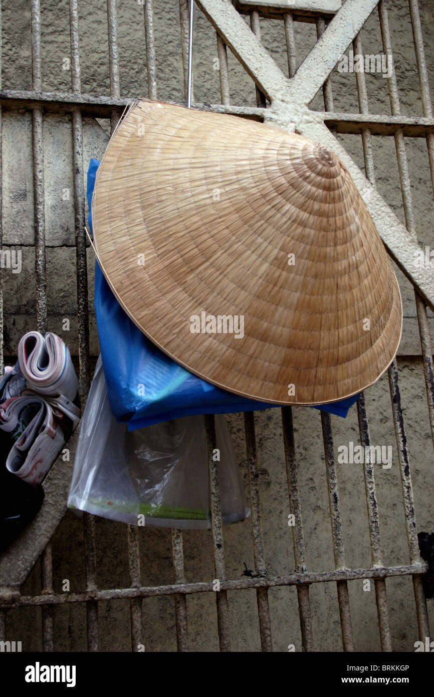 A traditional Vietnamese straw hat is part of the urban landscape in ...