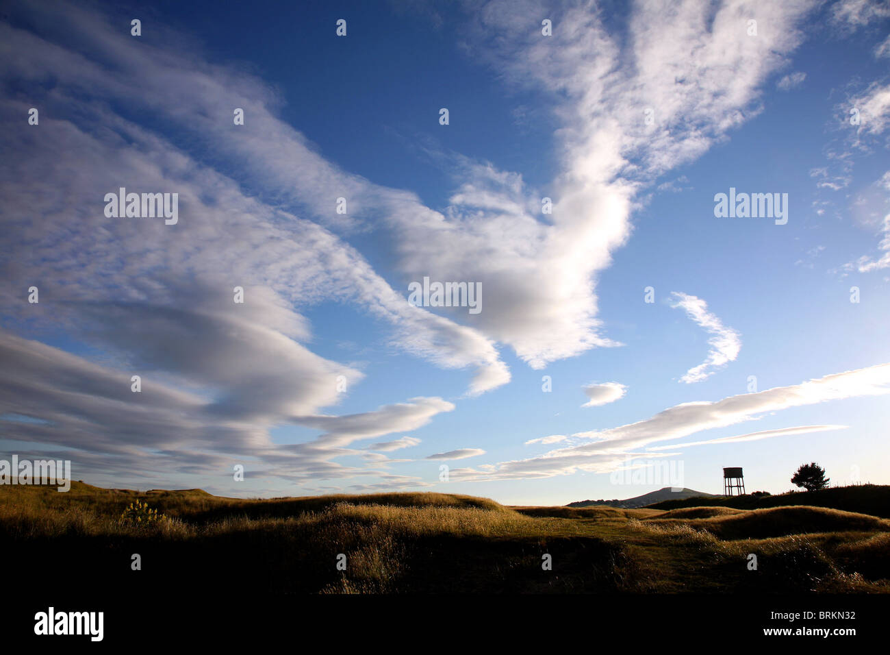 Dramatic clouds over Southgate Dunes Sandy Lane Water Tower and Cefn ...
