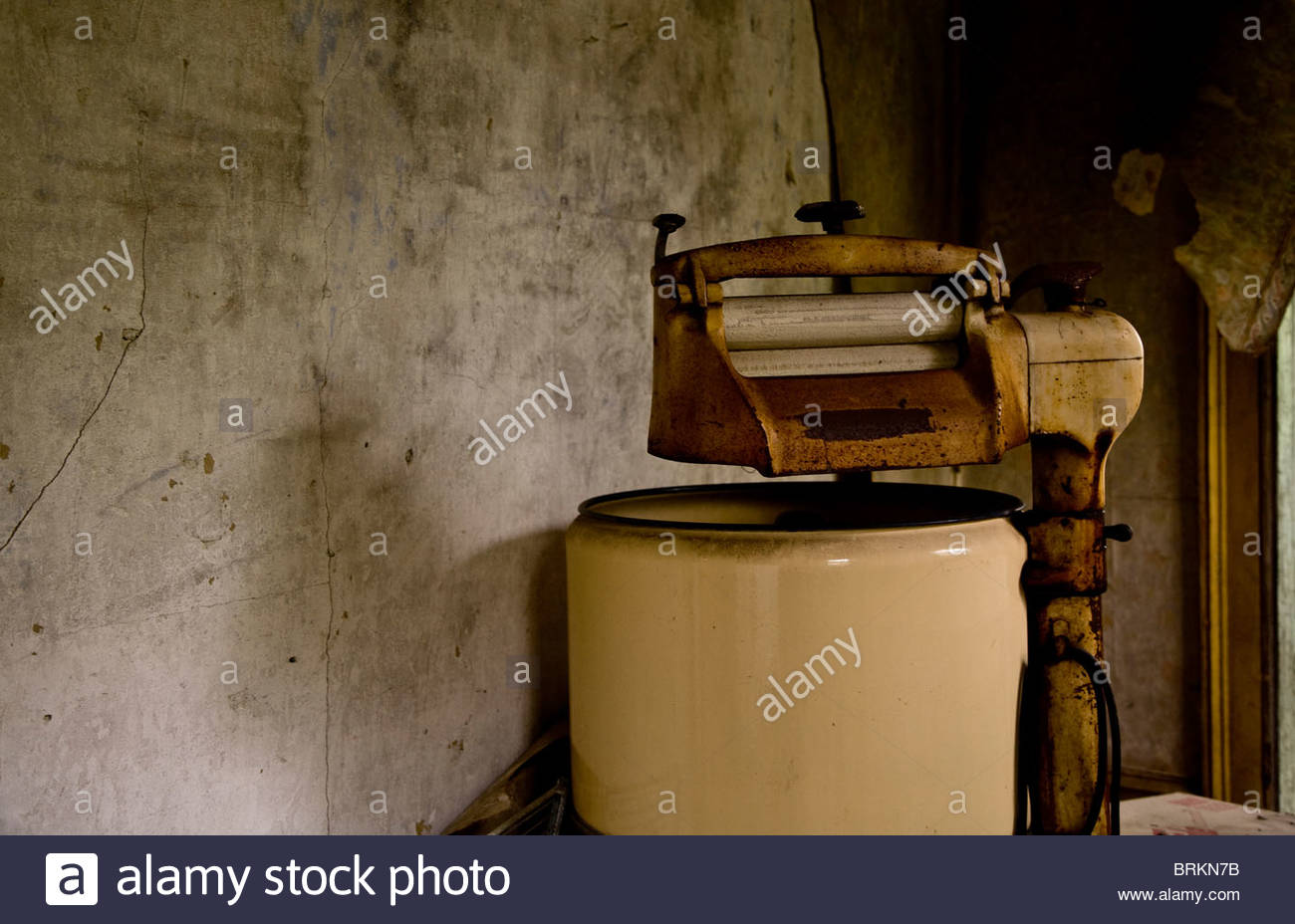 An old washing machine lies unused in an abandoned house Stock Photo ...