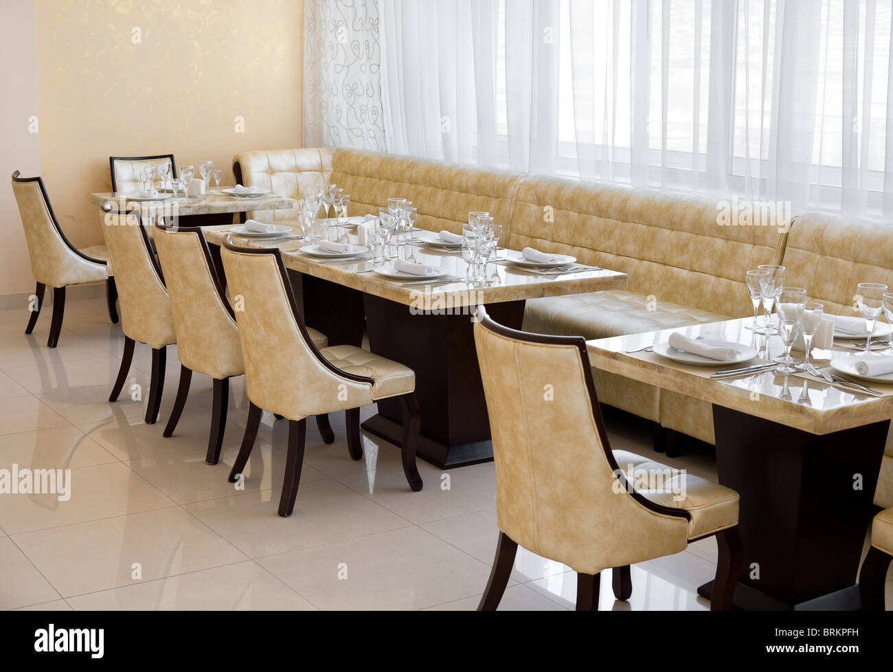 restaurant interior of beige colours with leather seats Stock Photo - Alamy