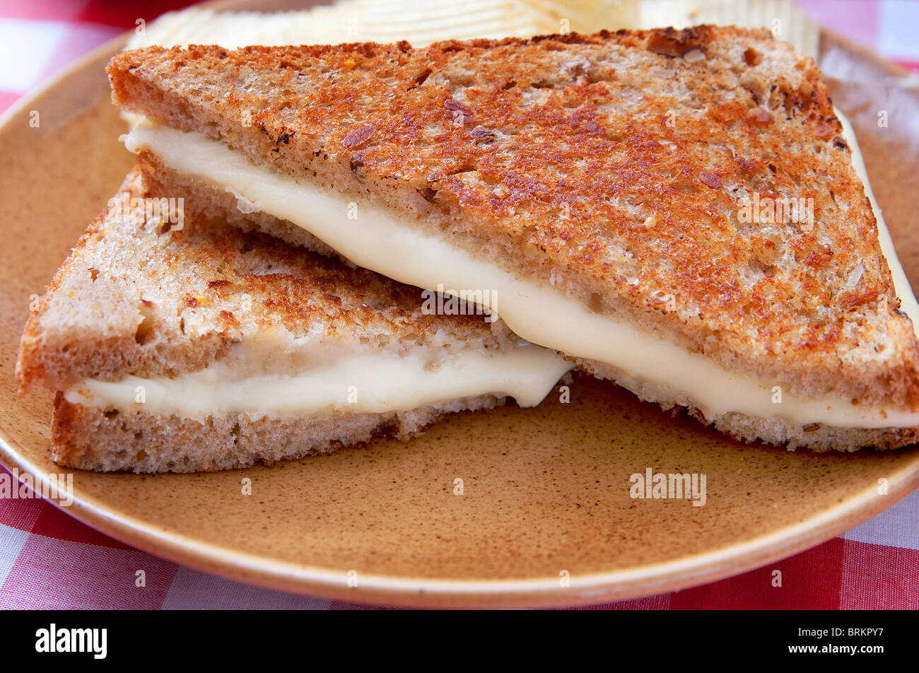 closeup of a toasted grilled cheese sandwich gooey with chips. macro ...