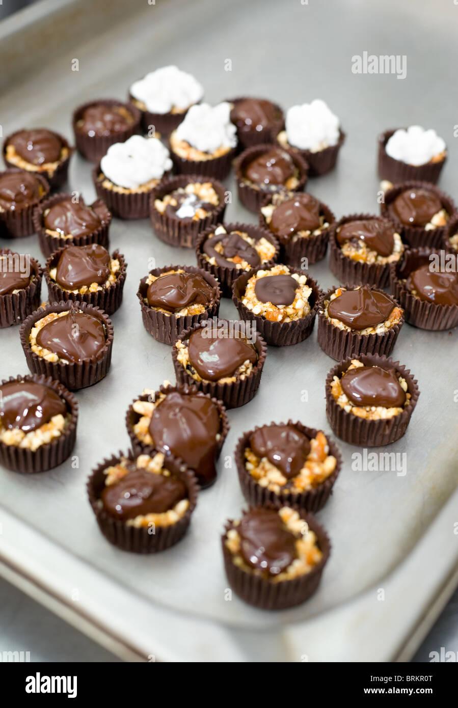 nut sweets in chocolate moulds made according to chefs recipe Stock ...