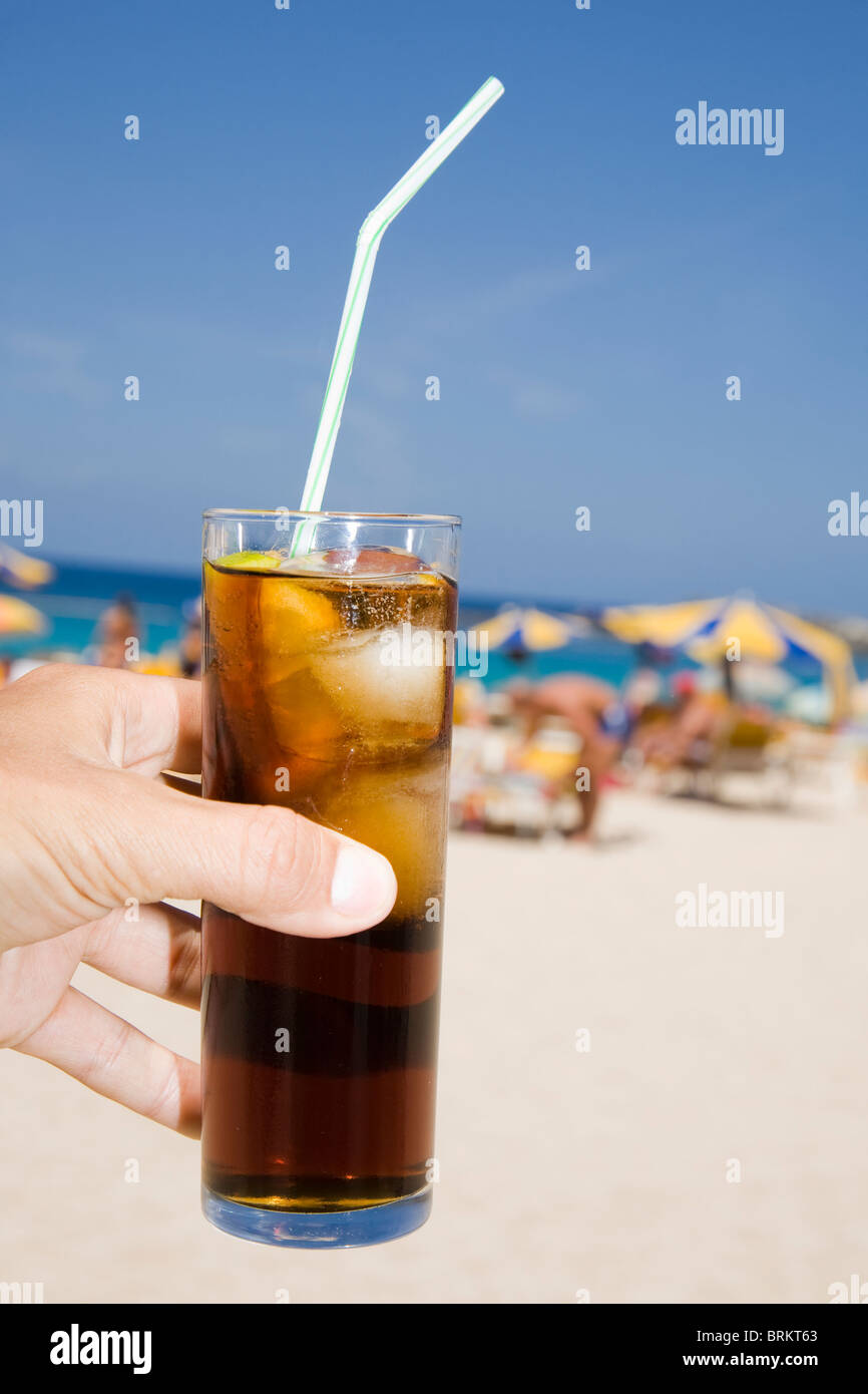 Cola drink with beach background Stock Photo - Alamy