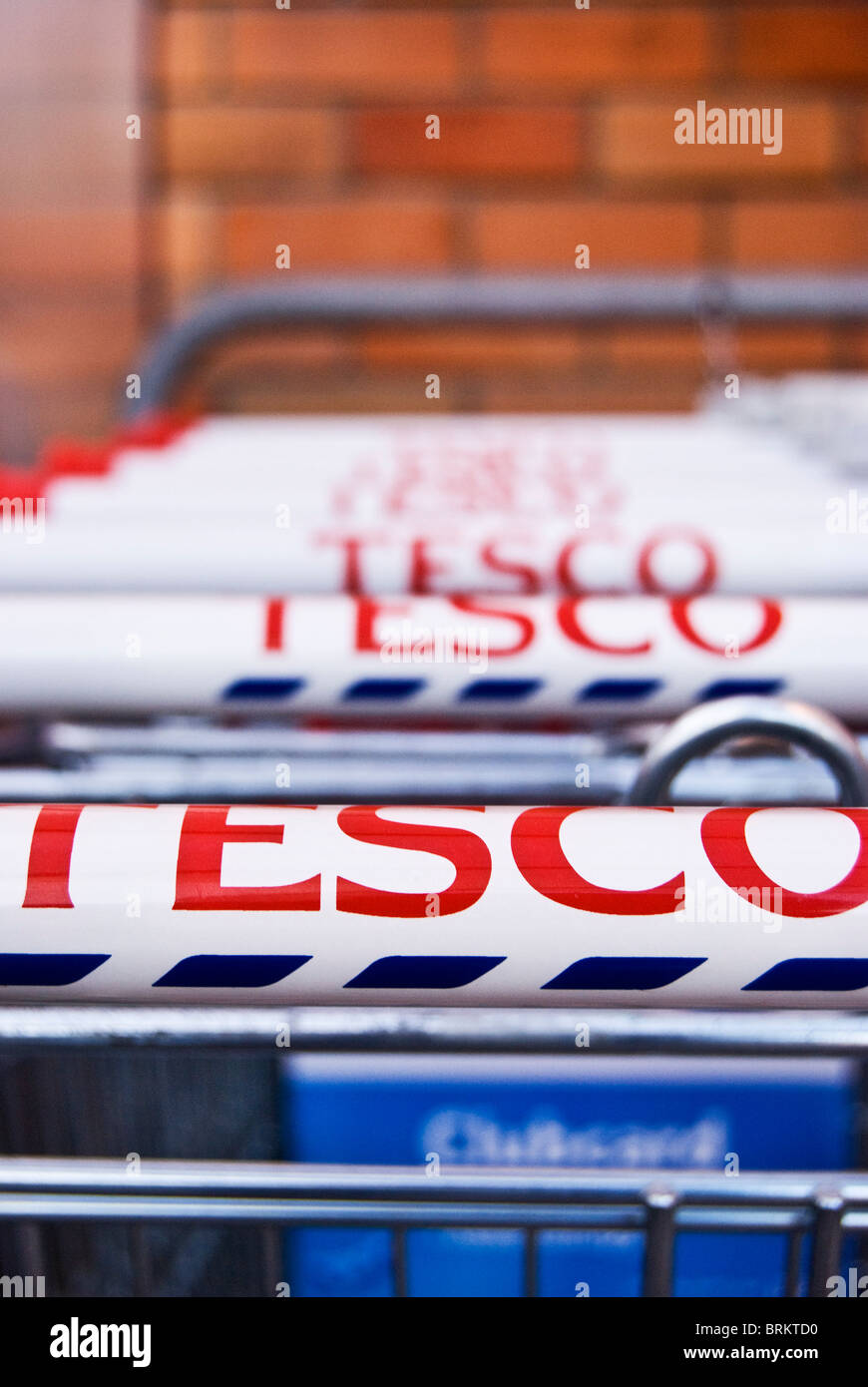 row of shopping carts with Tesco logo Stock Photo - Alamy