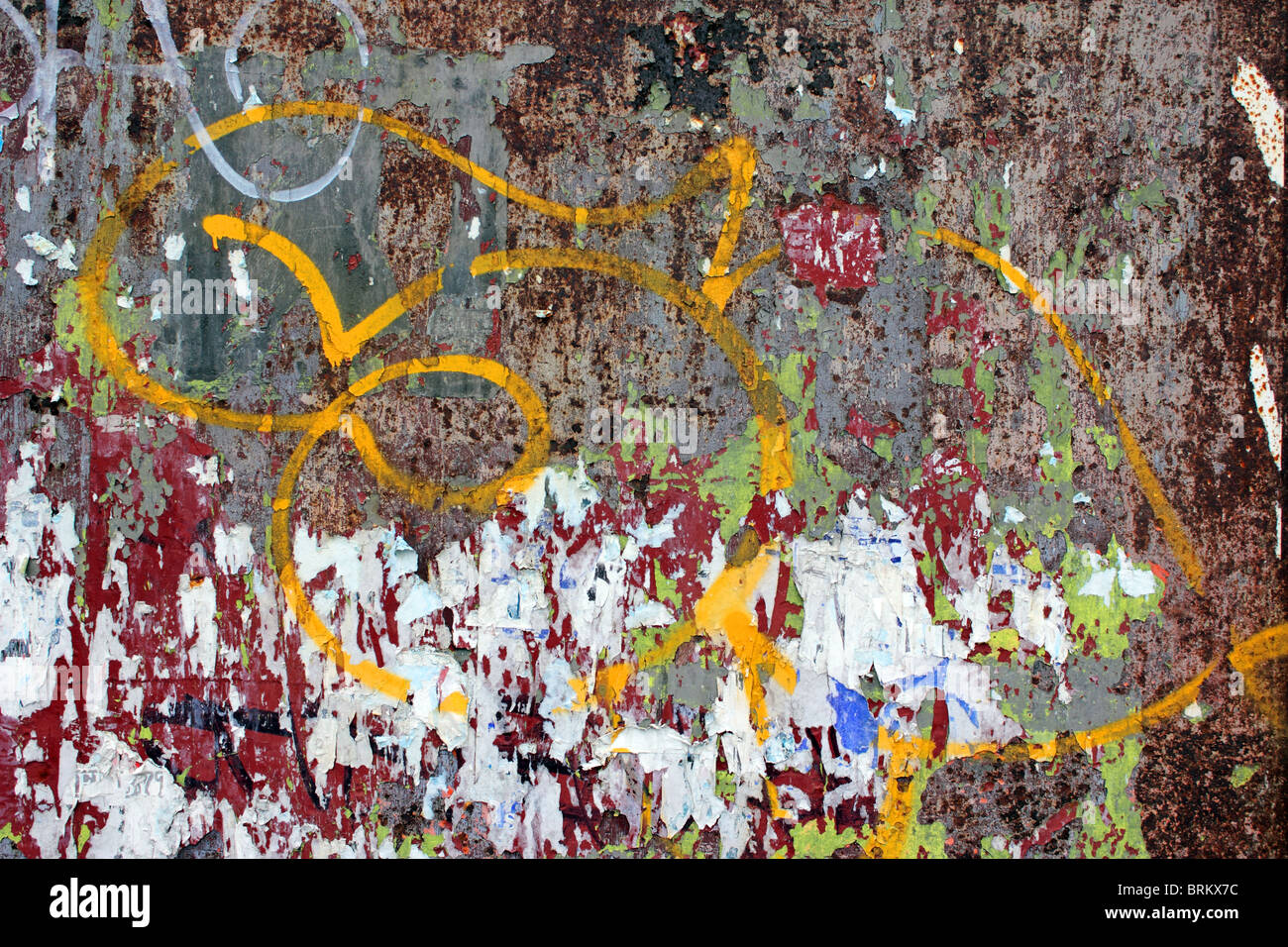 Remains of old posters and graffiti on a rusty iron bridge, London ...