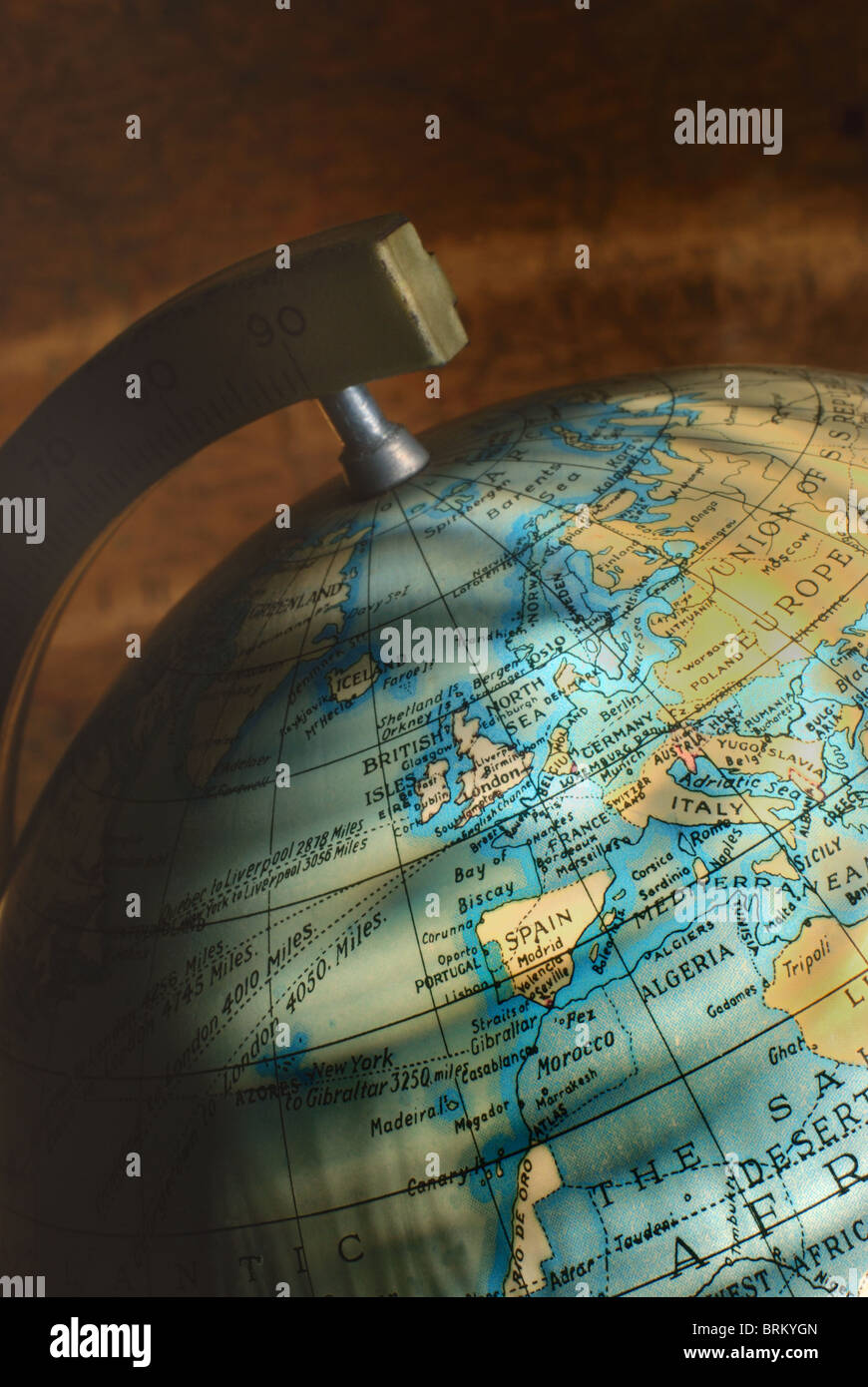 A small vintage globe of planet Earth , highlighting the UK and Western ...