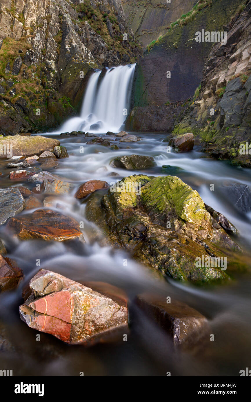Rocks, stream and waterfall at Spekes Mill Mouth beach in North Devon ...