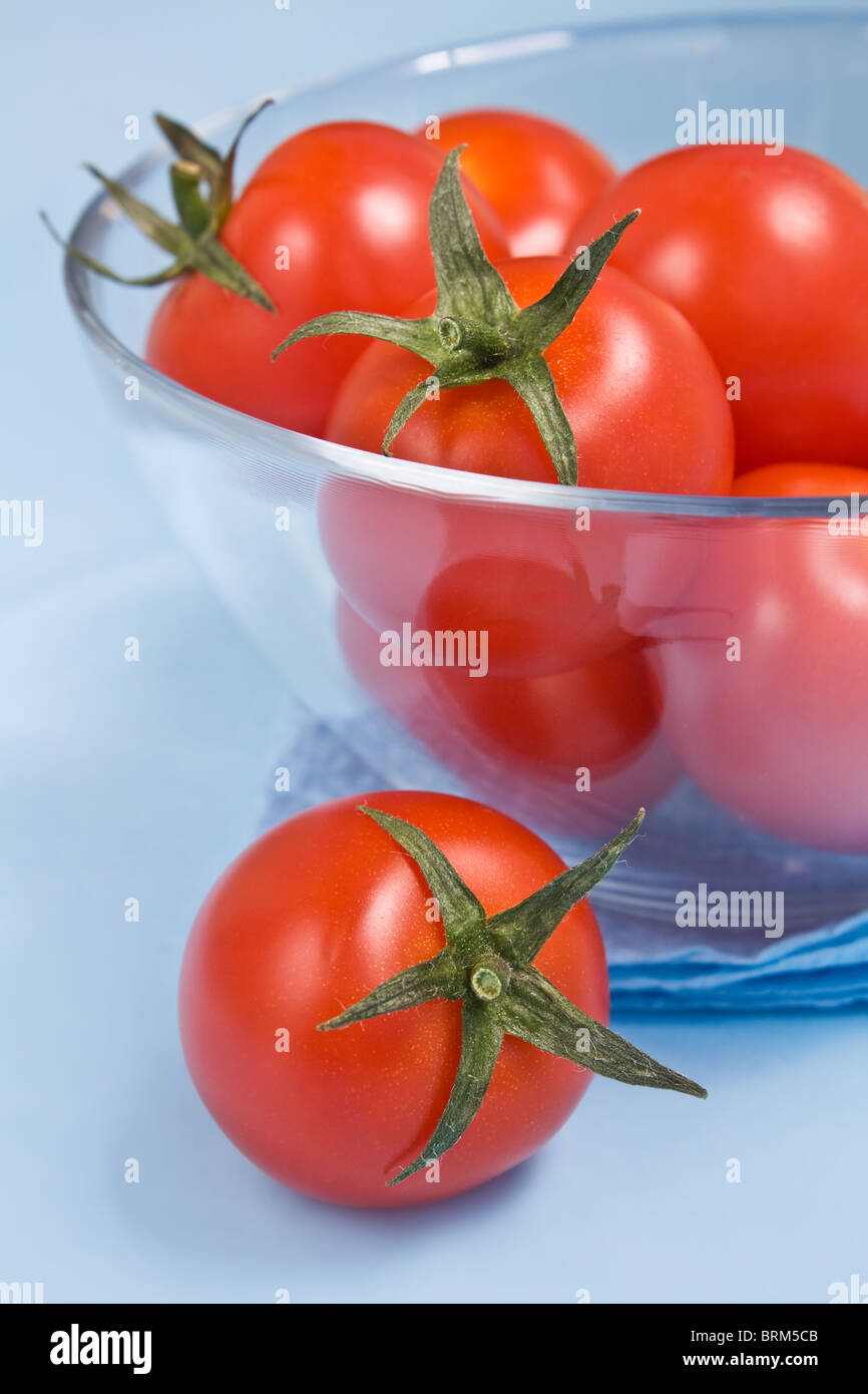 Some ripe cherry tomatoes in a glass bowl Stock Photo - Alamy