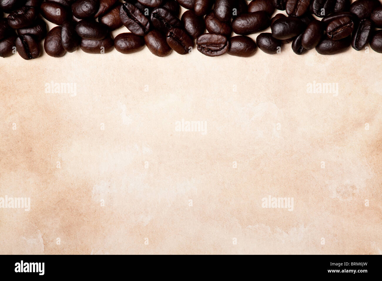 coffee beans on a parchment paper background Stock Photo - Alamy
