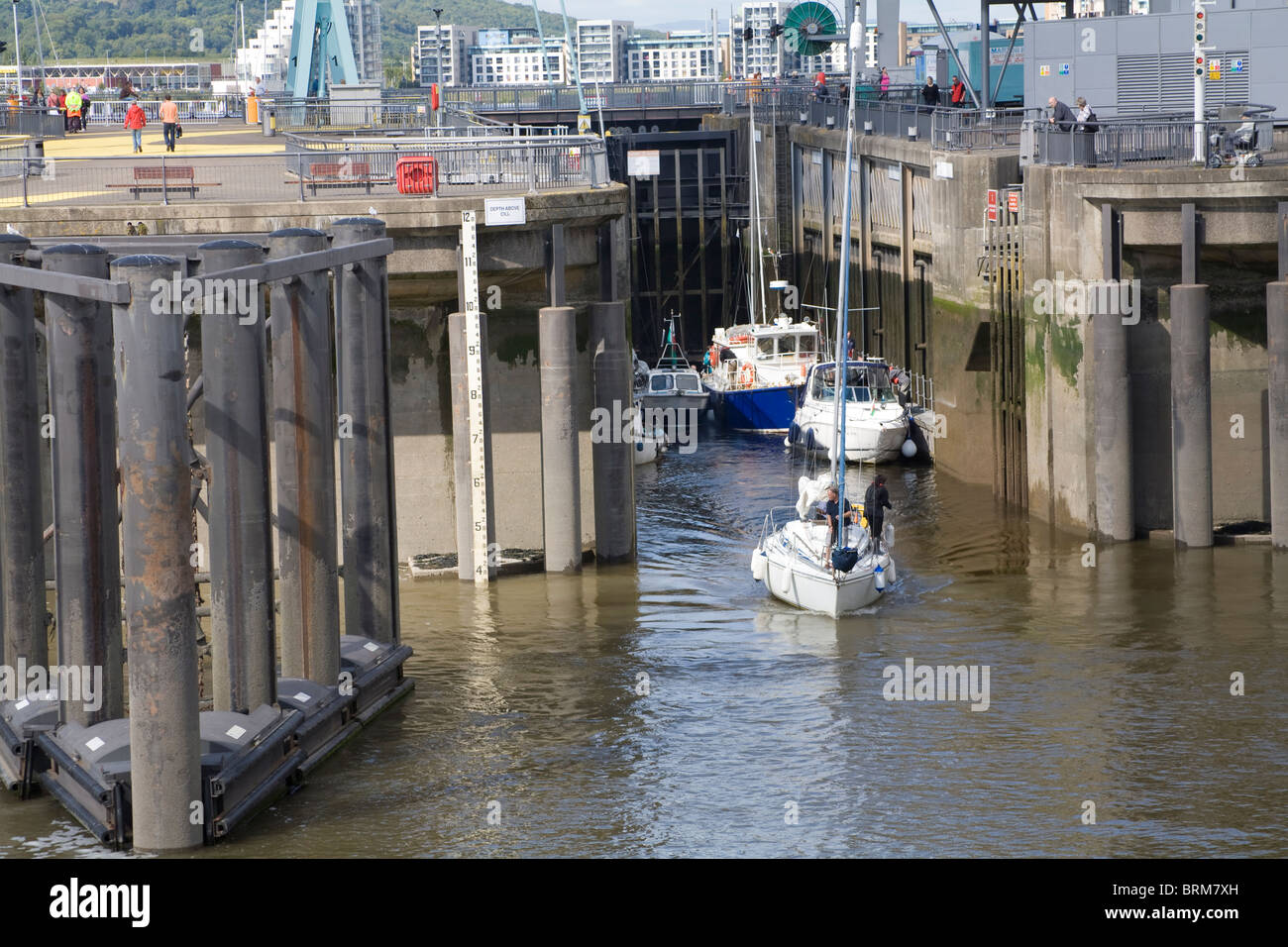 Cardiff Bay Glamorgan South Wales Leisure craft leaving a lock of Queen ...