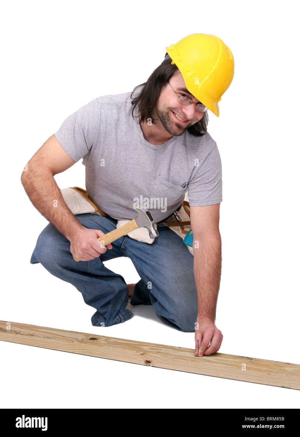 one thirties adult man doing carpentry work over white Stock Photo - Alamy