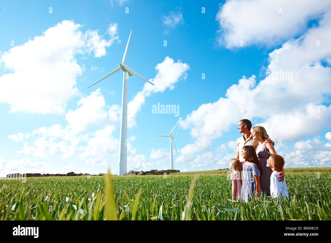 Family looking at wind turbines Stock Photo - Alamy