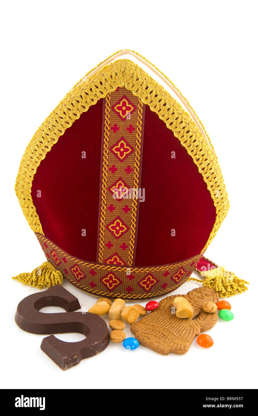 Miter from Sinterklaas with traditional candy isolated on white ...
