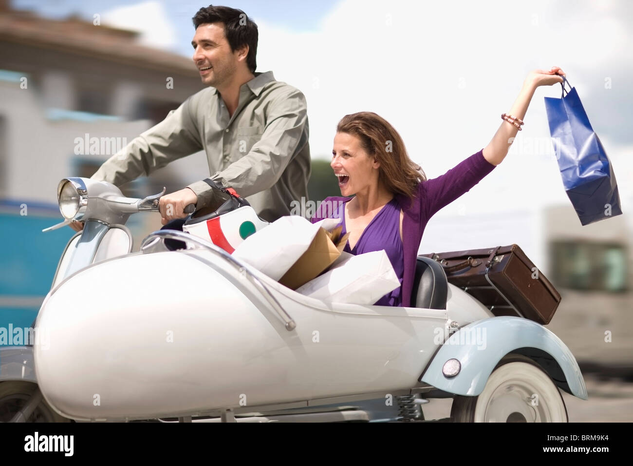 Couple driving home from shopping Stock Photo - Alamy