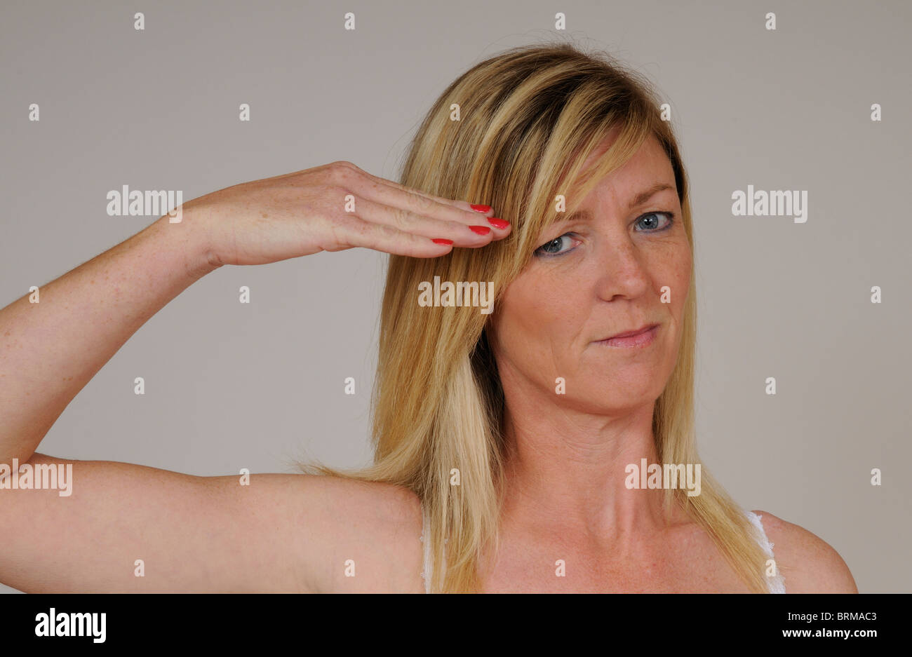Portrait of a woman saluting Stock Photo - Alamy