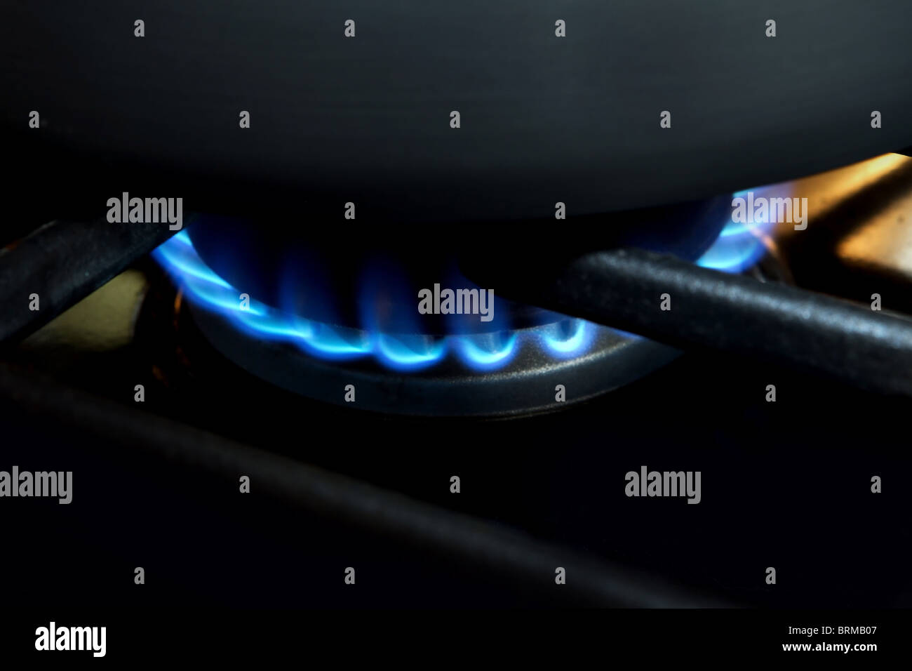 gas burner flame under a pot on a kitchen stove Stock Photo - Alamy