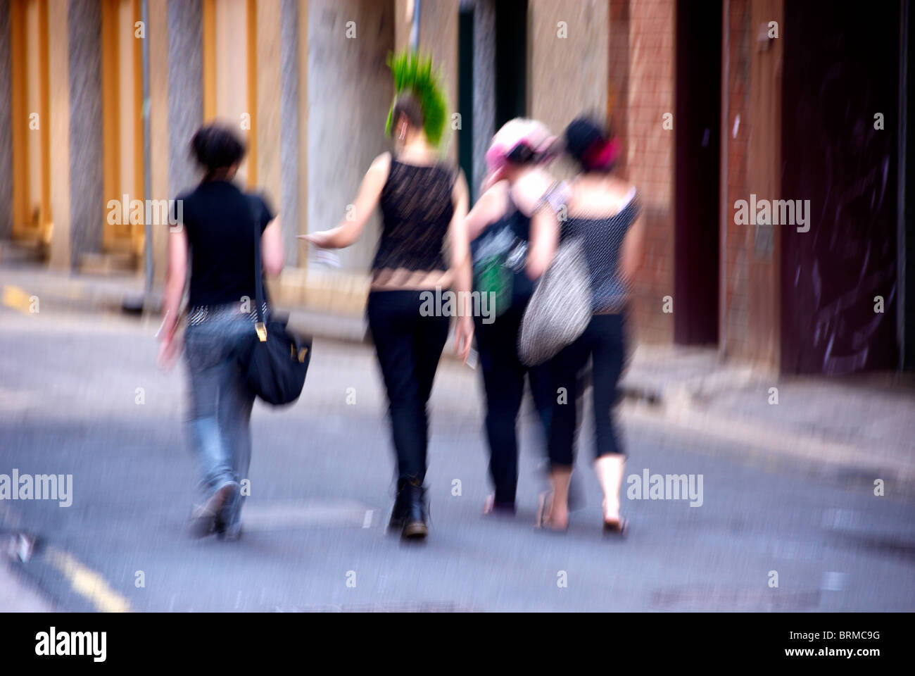 Girls dressed like punk rocker girls walking in the street of Adelaide ...