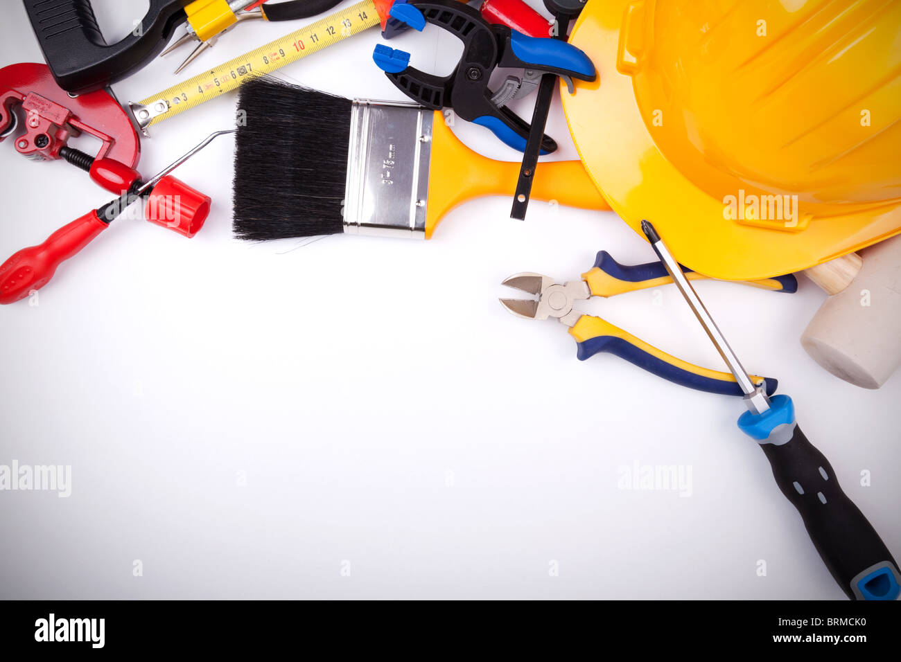 a mix of construction tools over a white background Stock Photo - Alamy