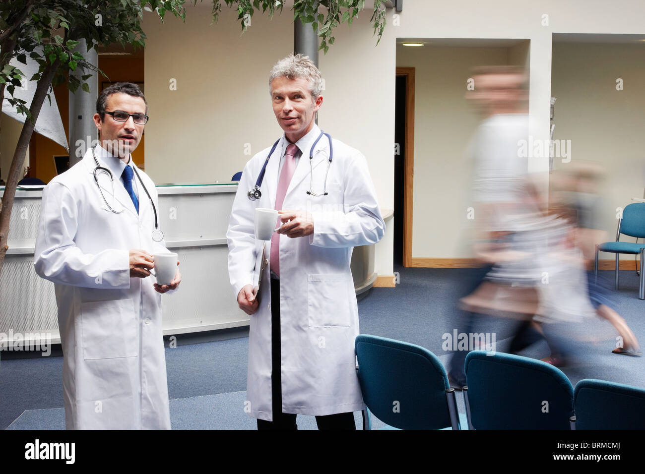 Doctors in waiting area Stock Photo - Alamy