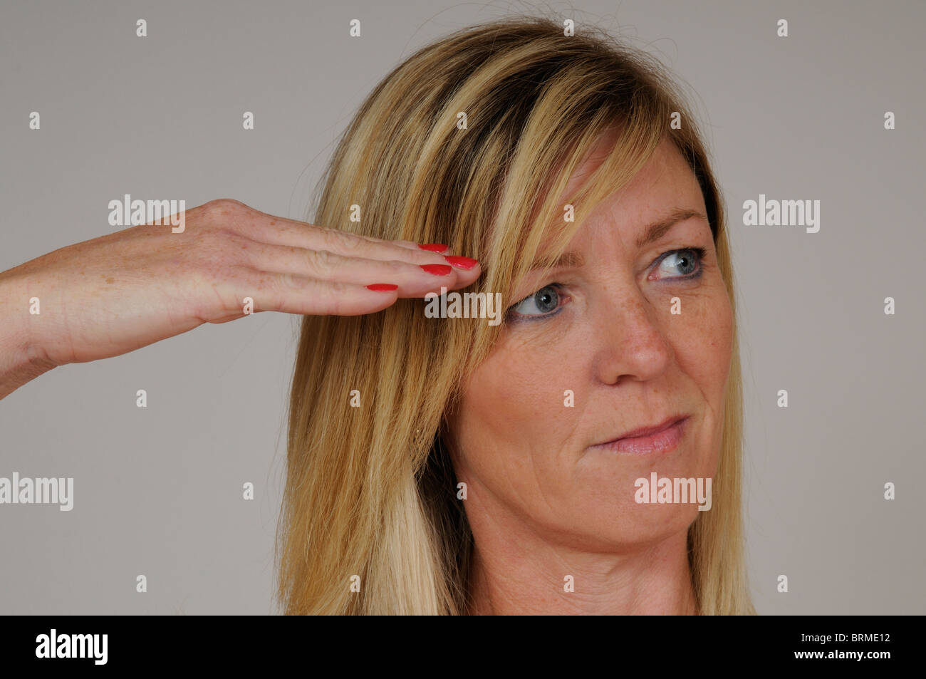 Portrait of a woman saluting Stock Photo - Alamy