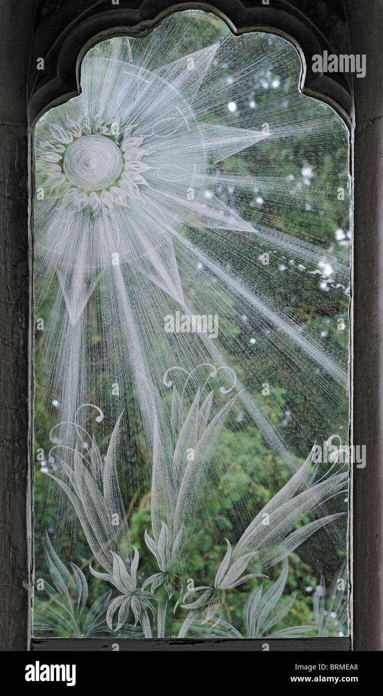 Sunrays etched in a memorial window of St Nicholas Church, Moreton ...
