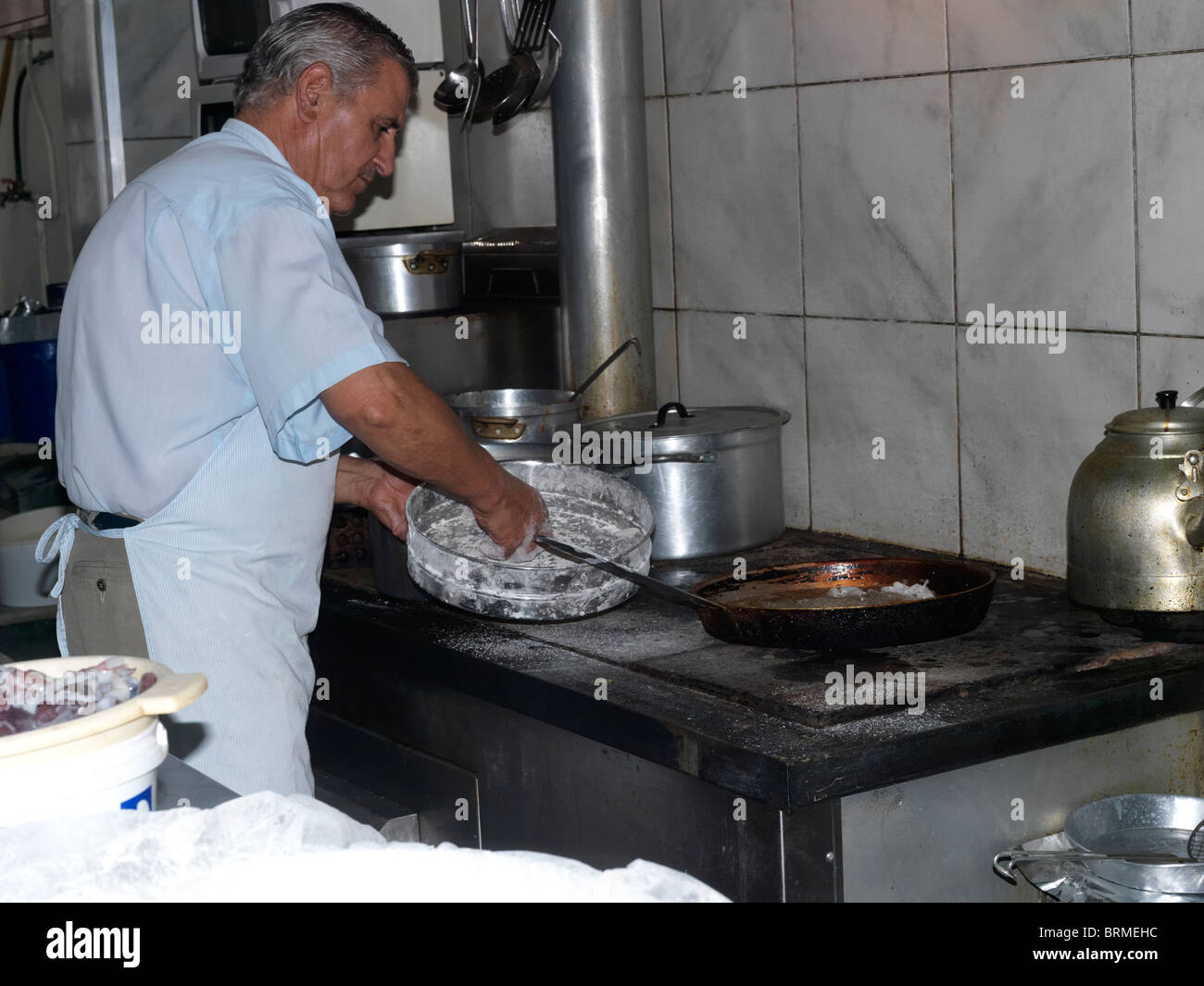 Aegina Greece Argo-Saronic Islands Man Cooking Battering Calamari Squid ...