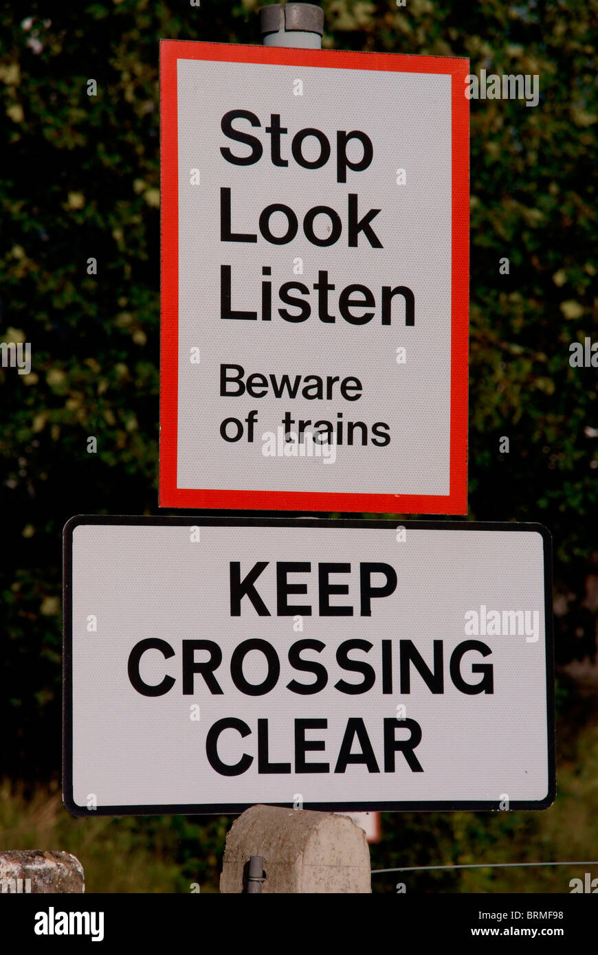 Railway pedestrian level crossing signage Stock Photo - Alamy