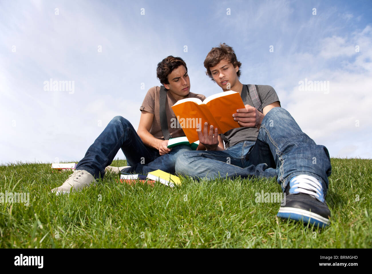 Two boys reading two books school hi-res stock photography and images ...