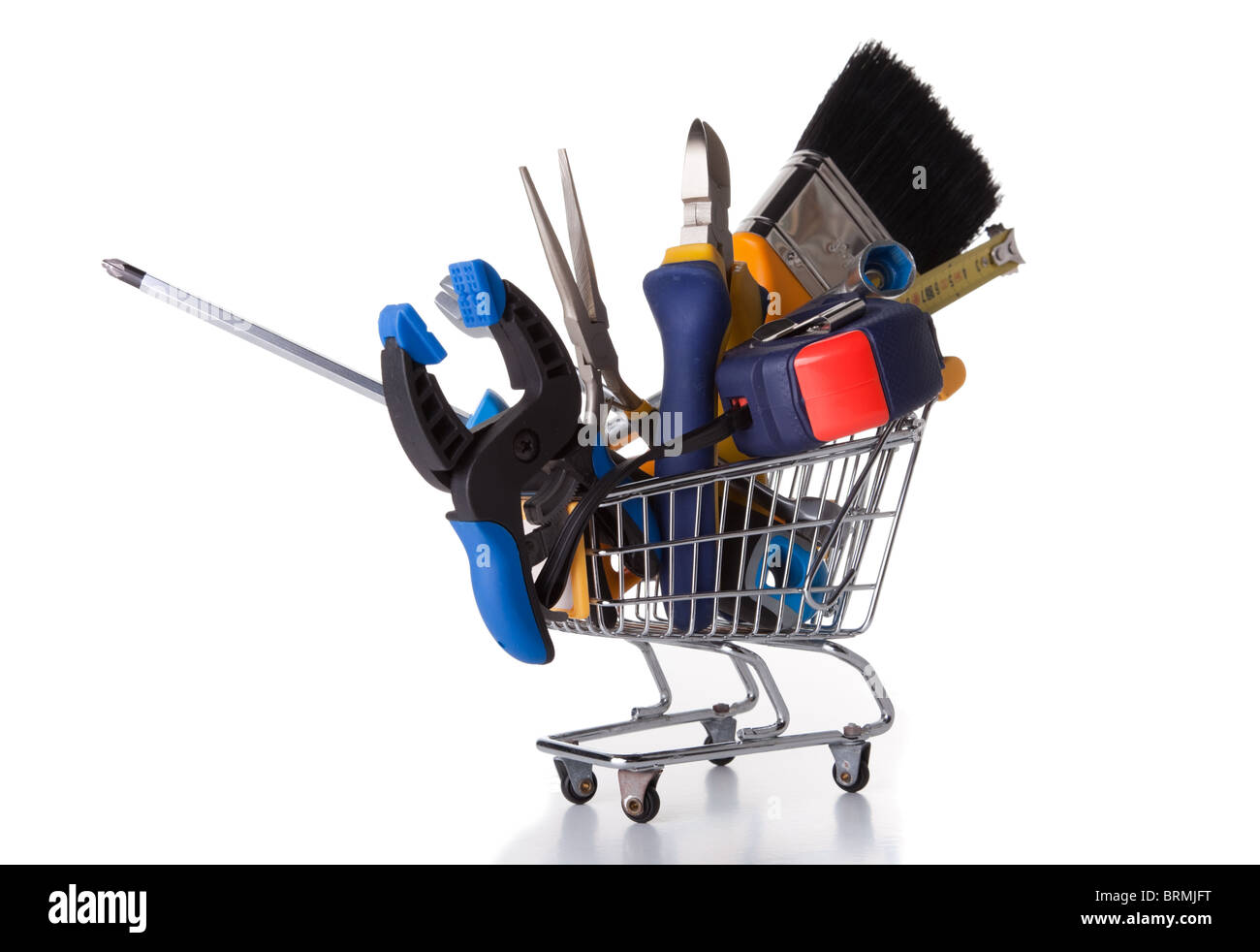 mix of construction tools inside a shopping cart (isolated on white ...