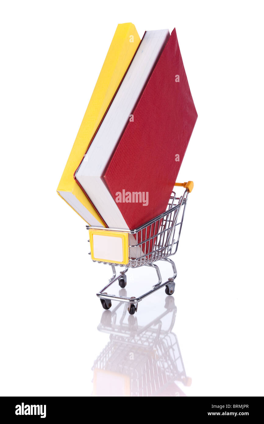 Stack of color books and a shopping cart (isolated on white Stock Photo ...