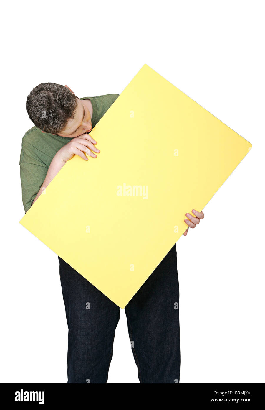 a man looking at a blank yellow sign Stock Photo - Alamy