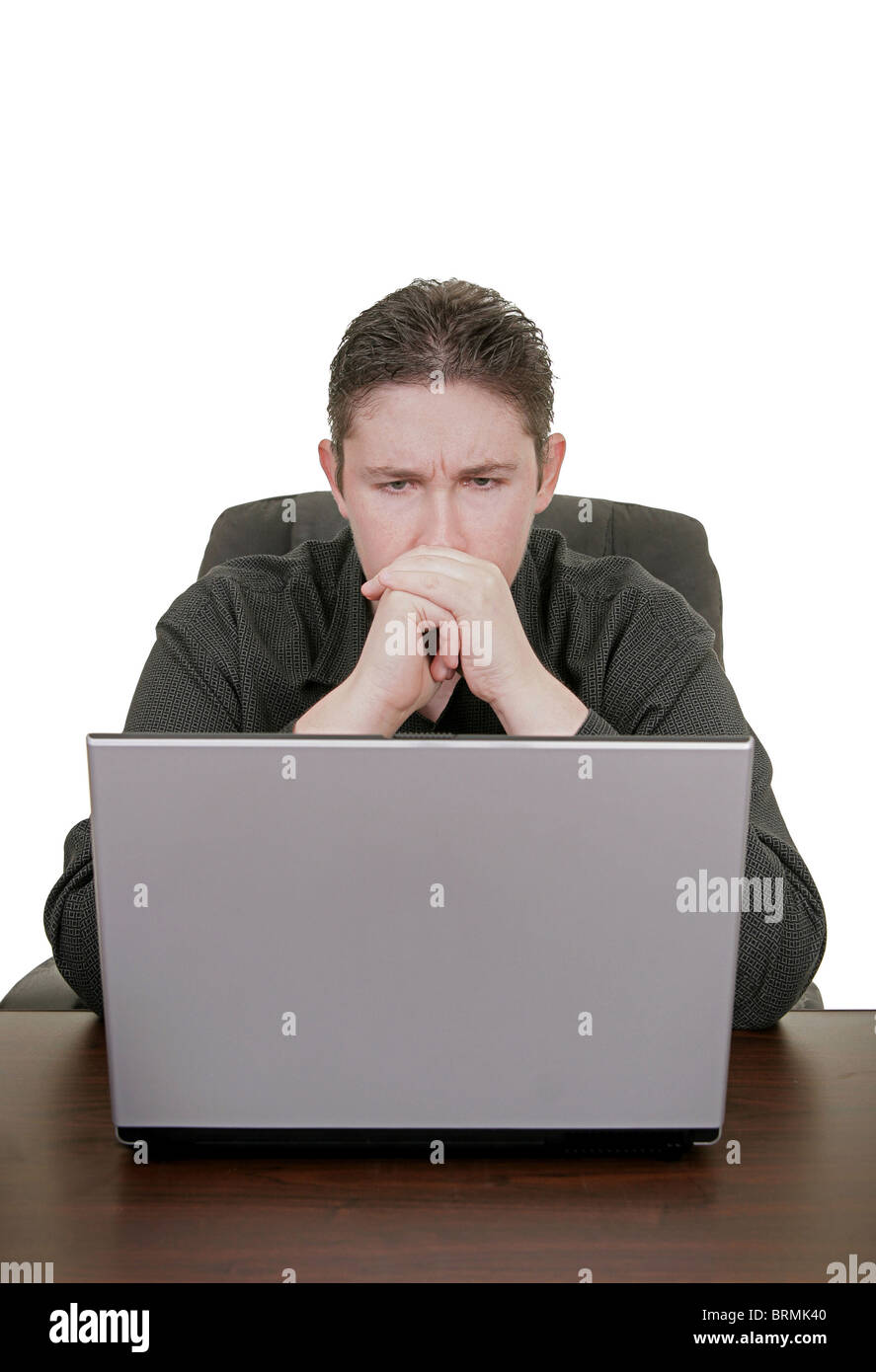 caucasian guy working on a laptop staring and concentrating Stock Photo ...