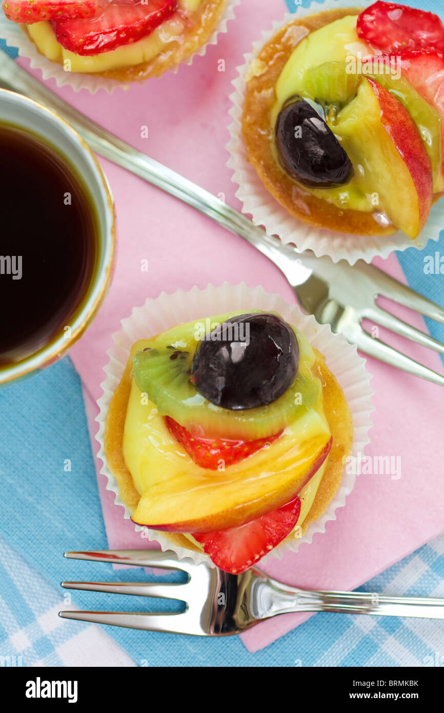 Closeup of two fruit pastries and tea Stock Photo - Alamy