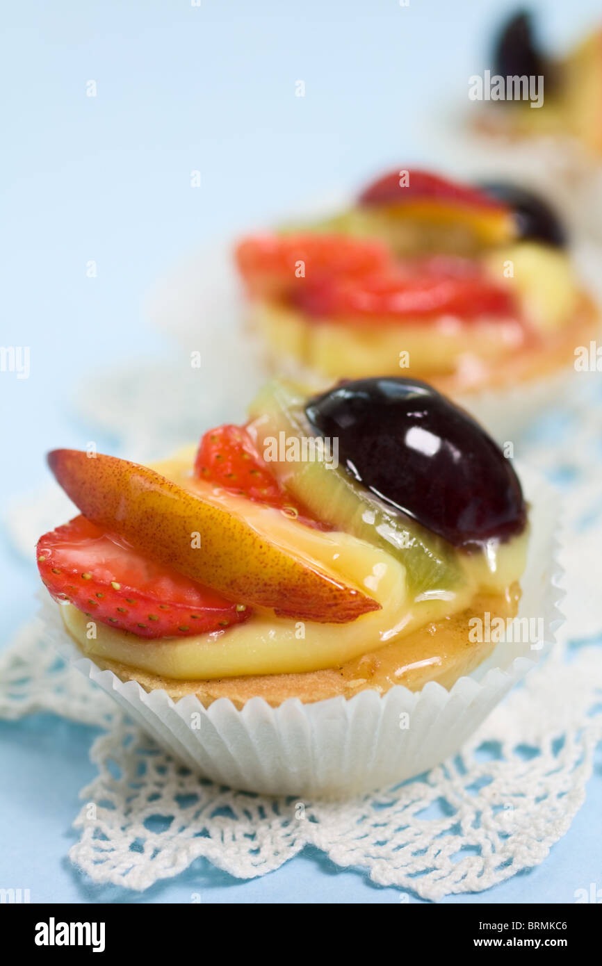 Sweet pastries with fruit and a fork Stock Photo - Alamy