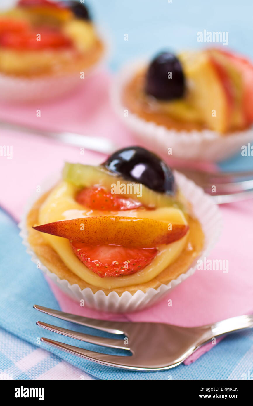 Sweet pastries with fruit and a fork Stock Photo - Alamy