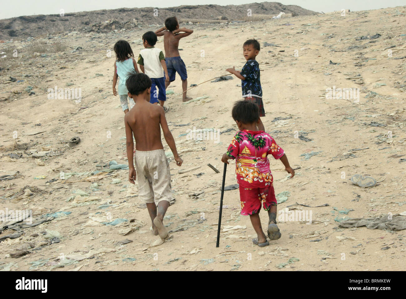 A group of child laborers take a walk at The Stung Meanchey Landfill in ...