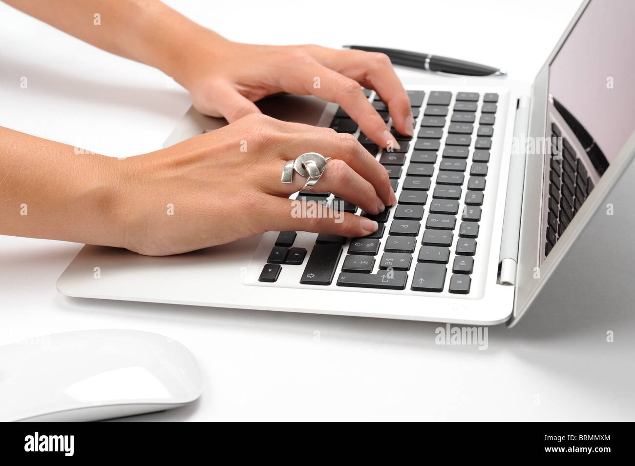 desk with laptop and hand Stock Photo - Alamy