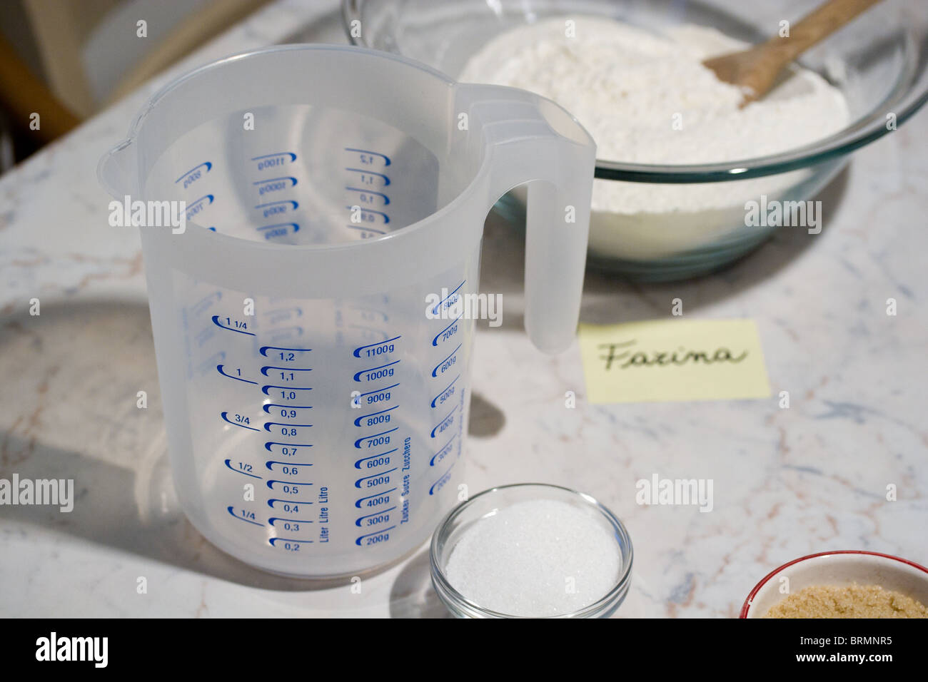 Measuring jug and italian flour in the kitchen Stock Photo - Alamy