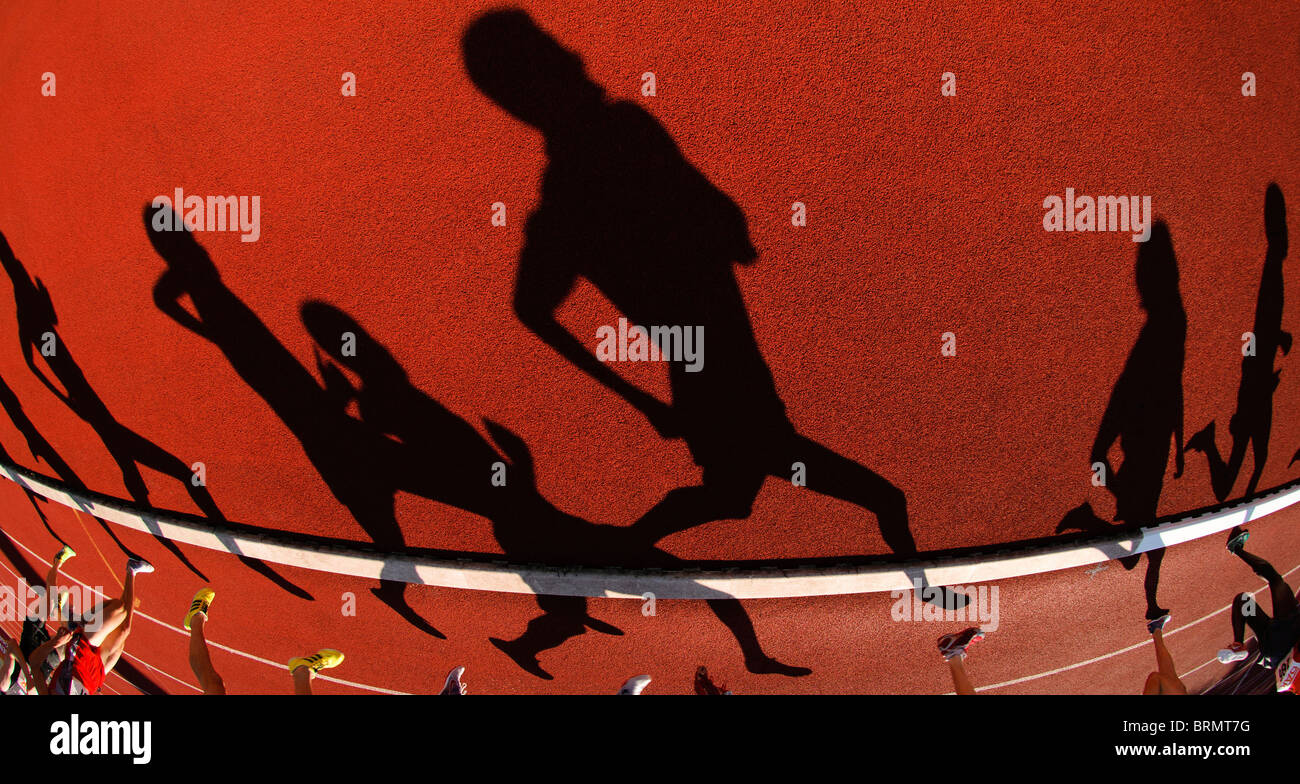 shadows of runners during 800m race during outdoor track and field ...