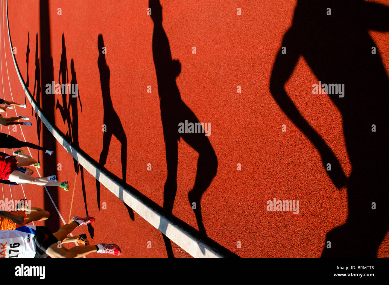 shadows of runners during 800m race during outdoor track and field ...