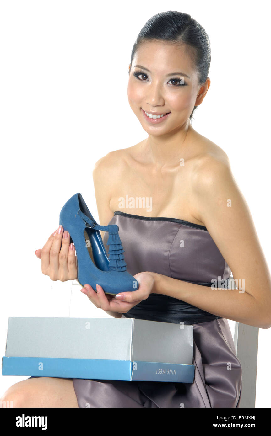 Woman advertising a shoe Stock Photo - Alamy