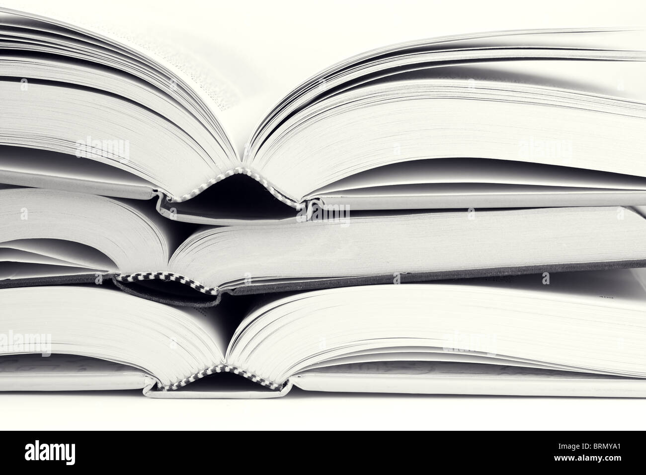 Some open big books in black and white Stock Photo - Alamy