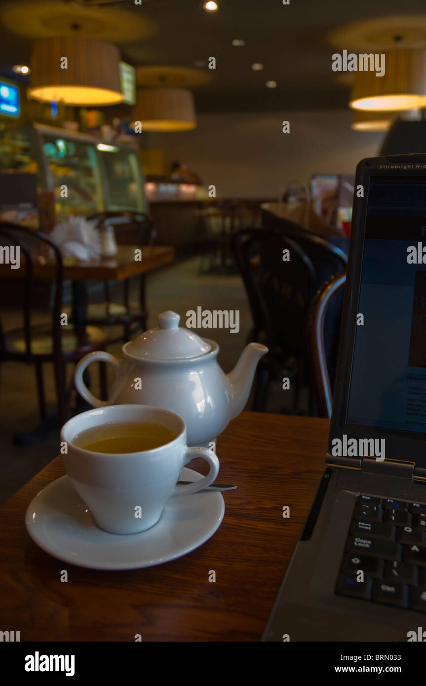 Tea in a cafe next to laptop computer central St Petersburg Russia ...