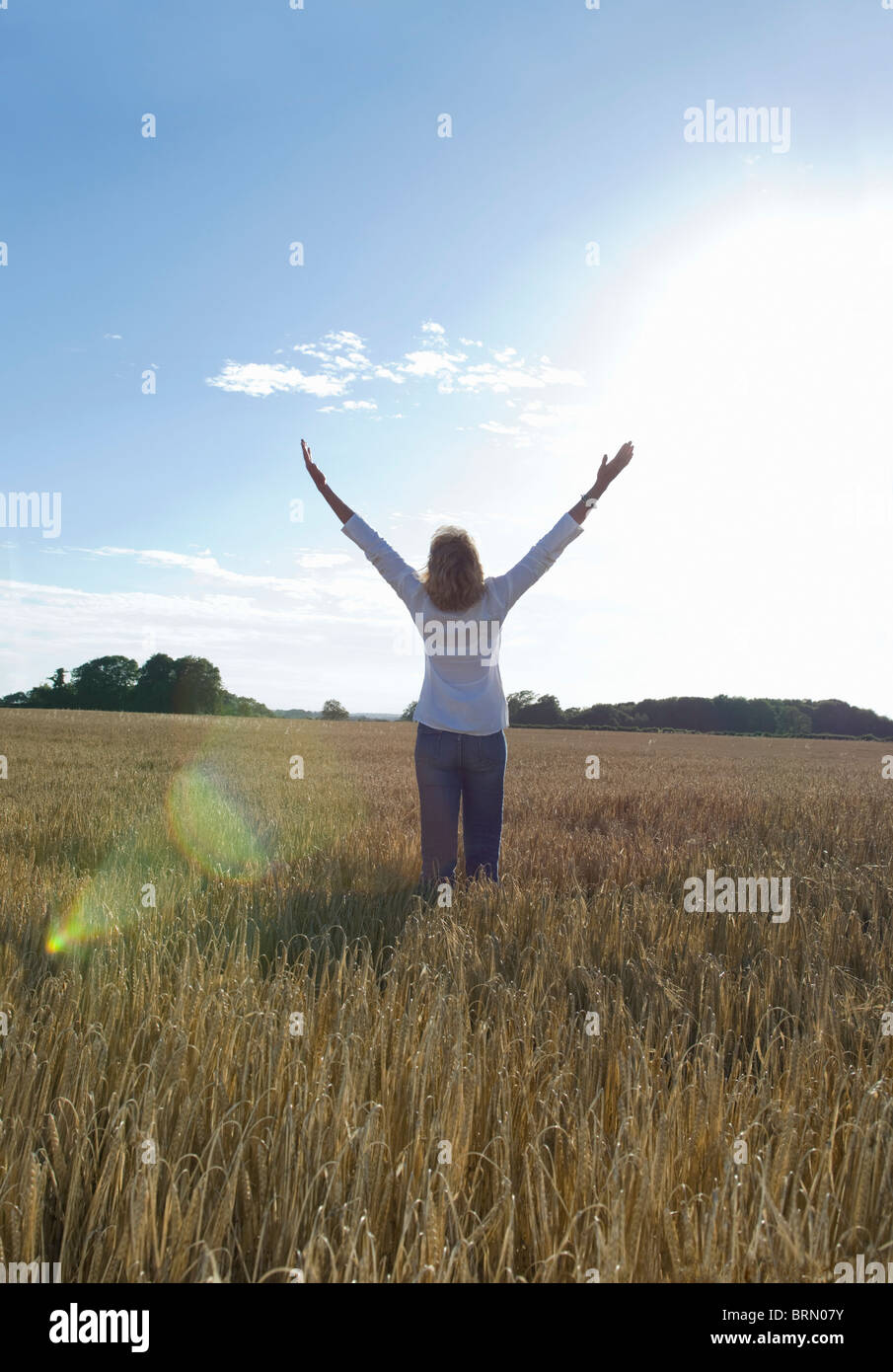 Woman sun worshiping Stock Photo - Alamy